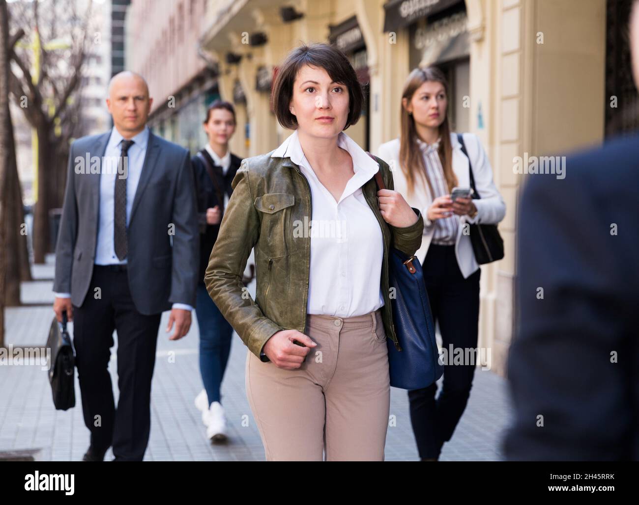 Hurrying woman walking on street Stock Photo - Alamy