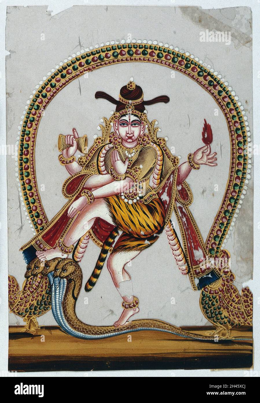 Four armed Shiva dancing on a snake, around a ring of flames. Gouache ...