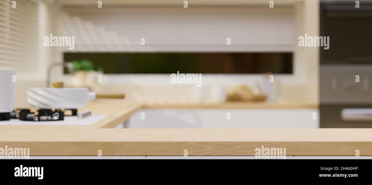 Close-up wooden kitchen countertop for montage over blurred furnished ...
