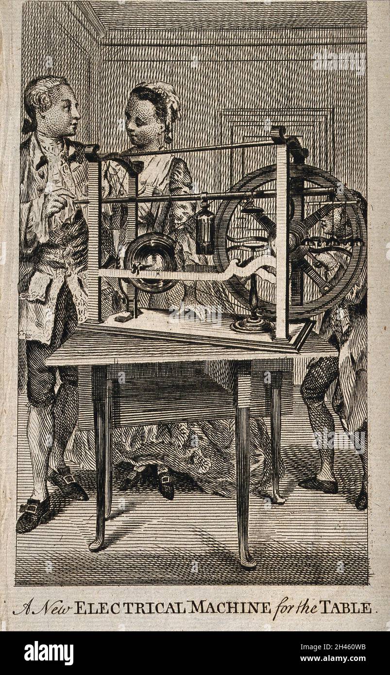 An electrical machine: a man is shown demonstrating a table-top ...