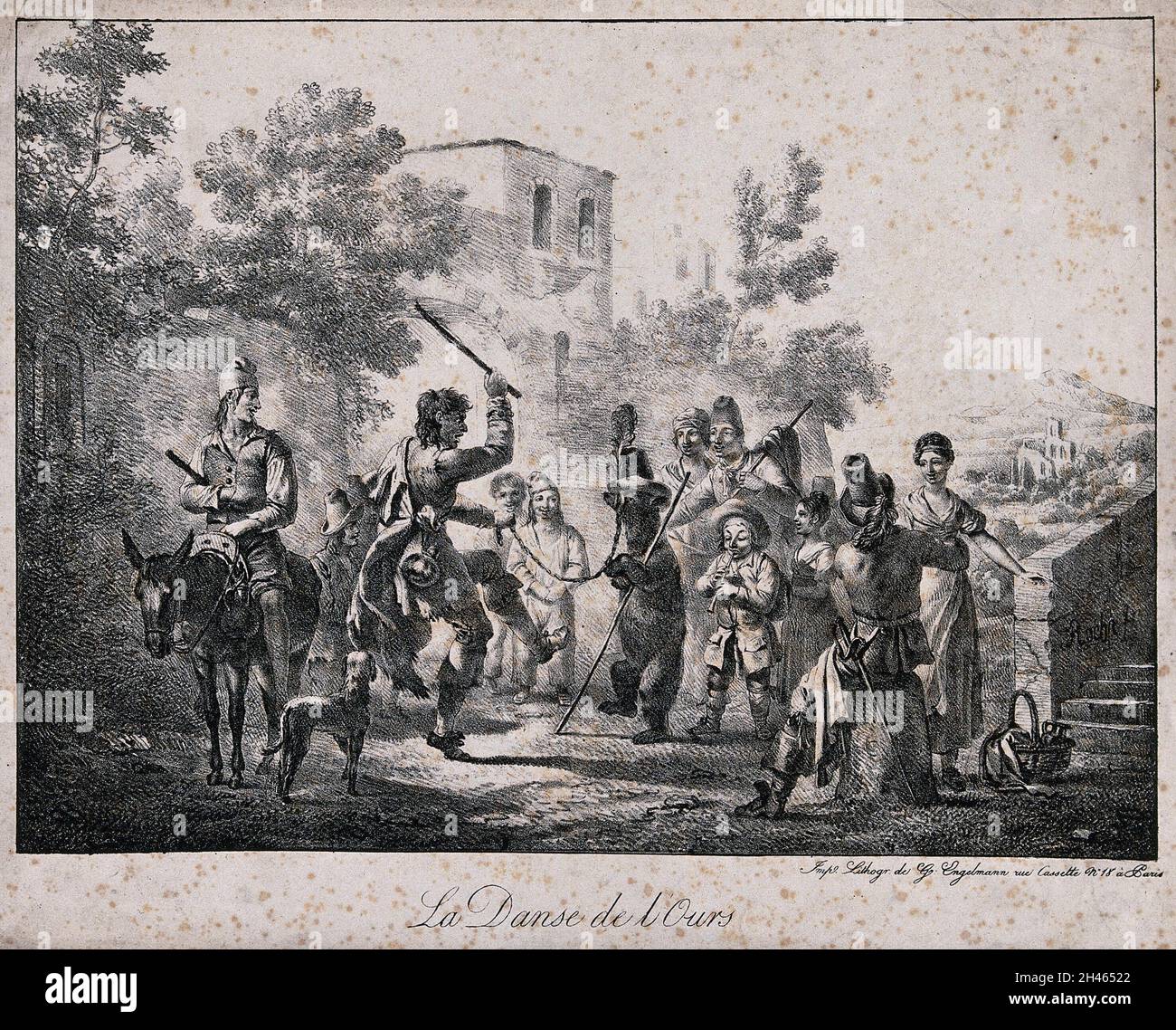 A chained bear being made to dance by a man holding a stick ...