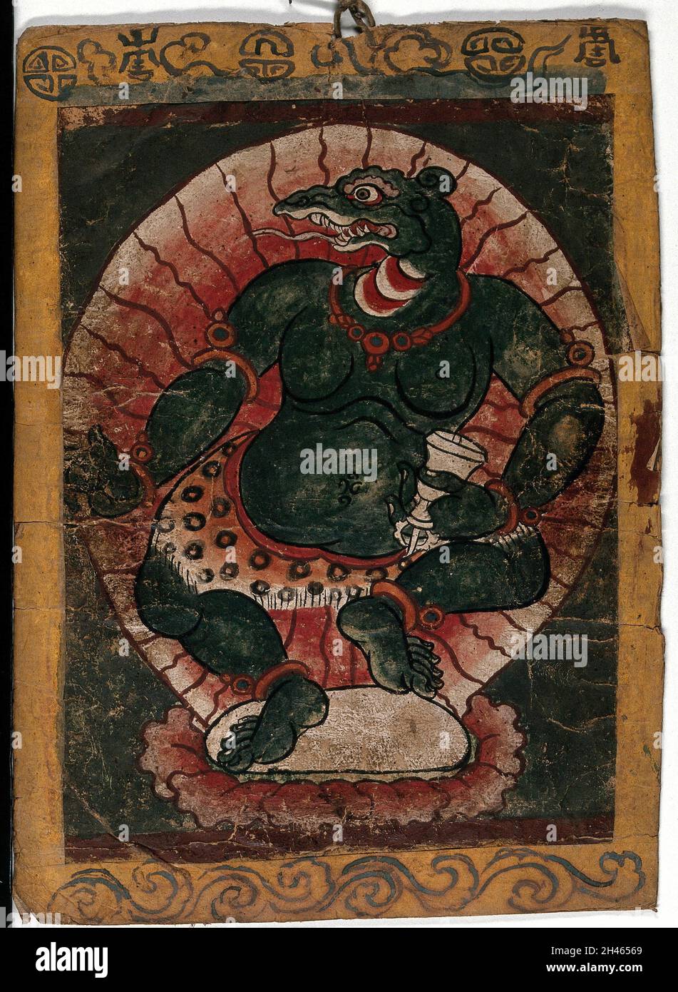 A green Tibetan monster with a snake's head (?), holding a bell, and ...