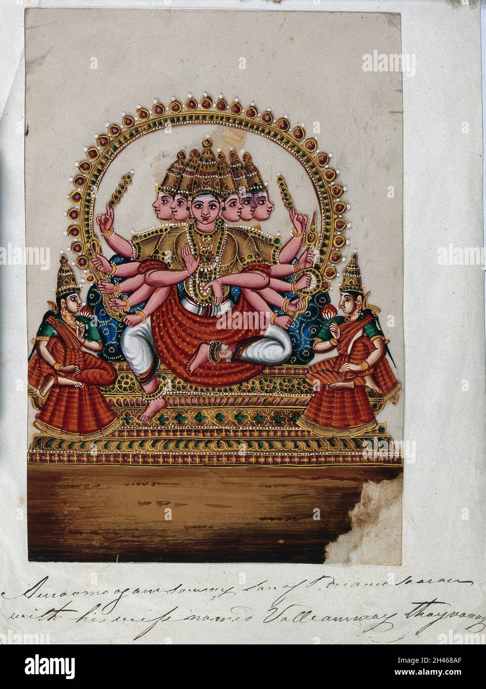 An Indian deity with twelve arms and six heads sitting with his wife ...