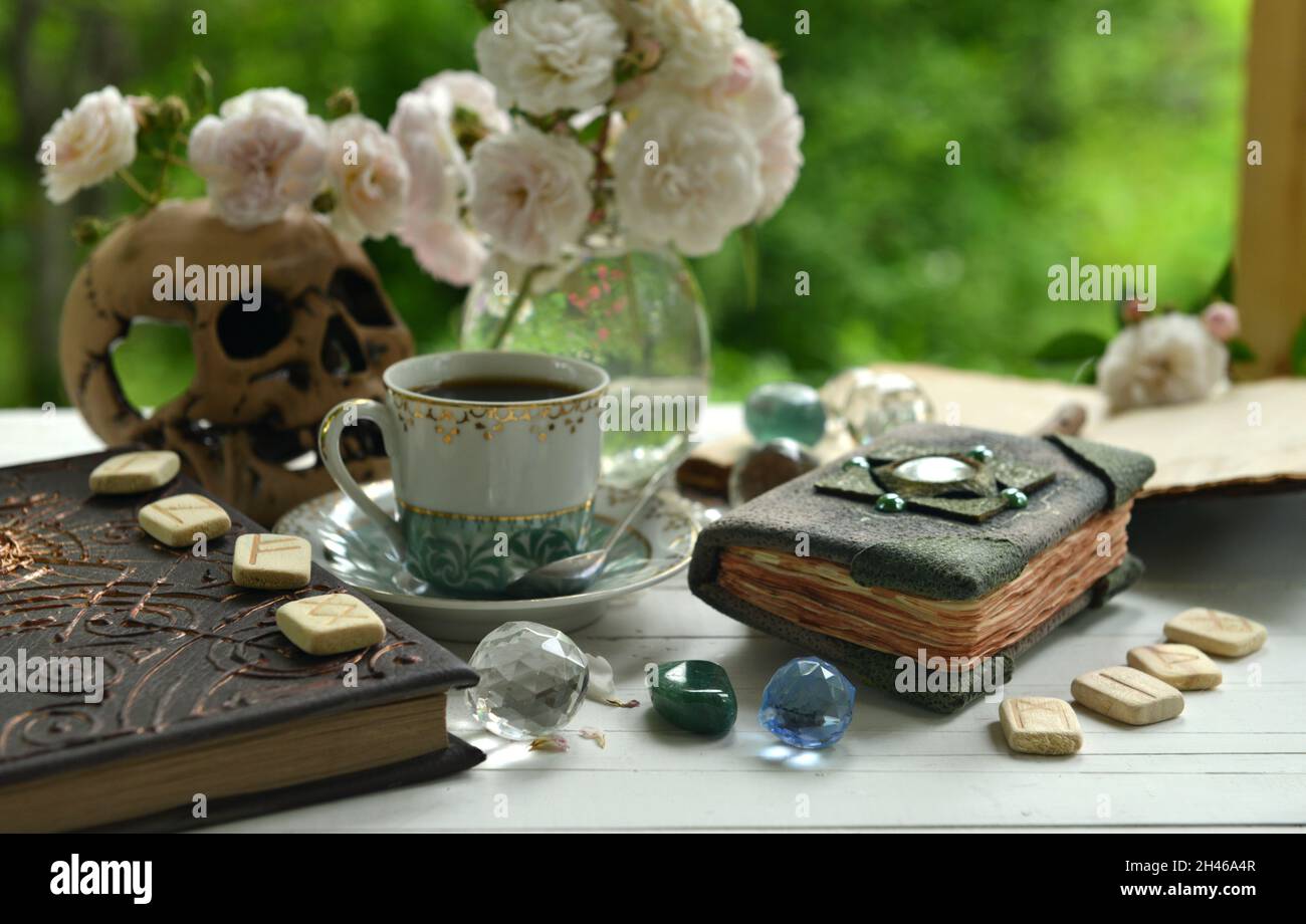 Vintage summer still life with old book, crystals and runes on witch ...