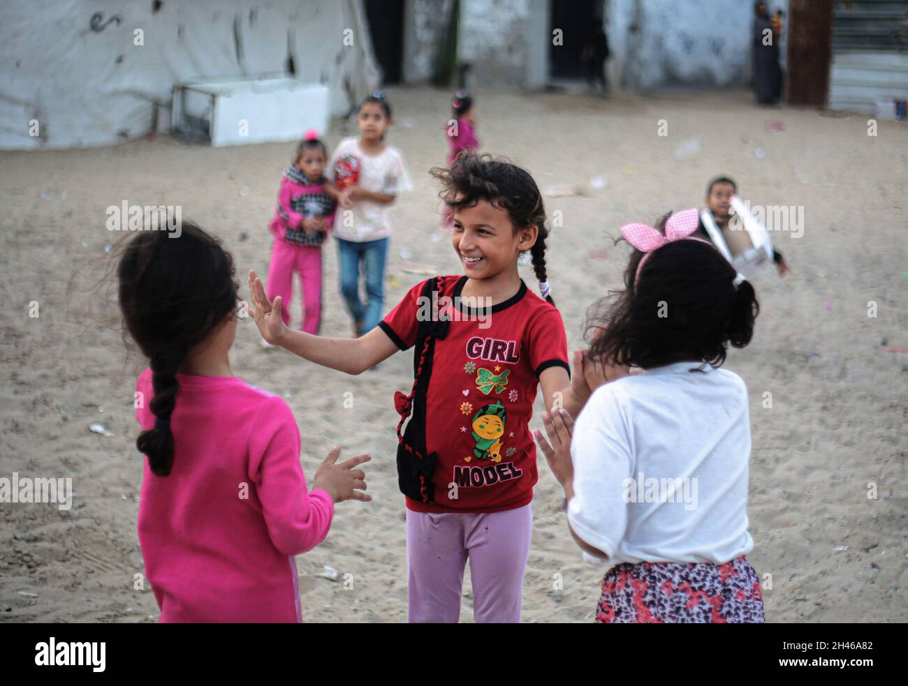 Gaza, Palestine. 31st Oct, 2021. Palestinian children play in front of ...