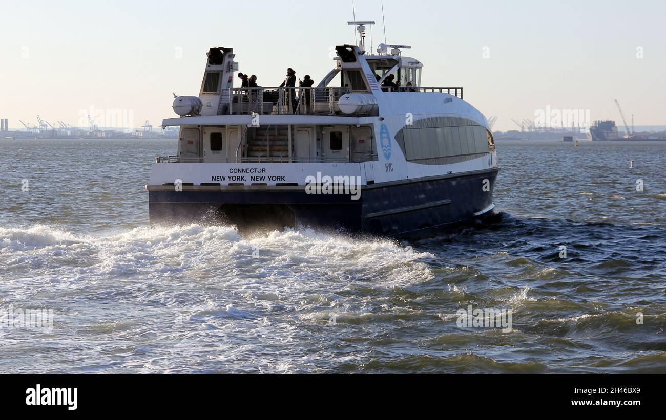 Commuter ferry boat CONNECTOR leaving Brooklyn Army Terminal pier, rear ...