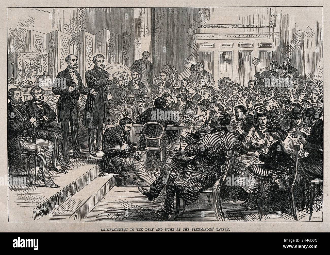 Two men performing a show to an audience at a public house, using sign ...