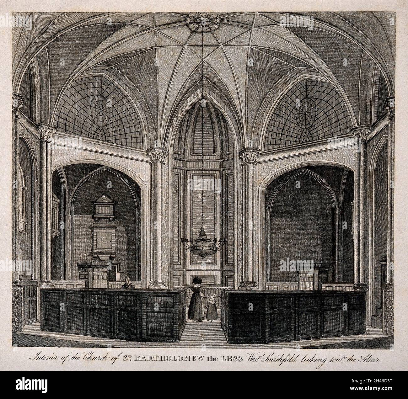 St Bartholomew the Less, Smithfield, London: the interior with a lady ...