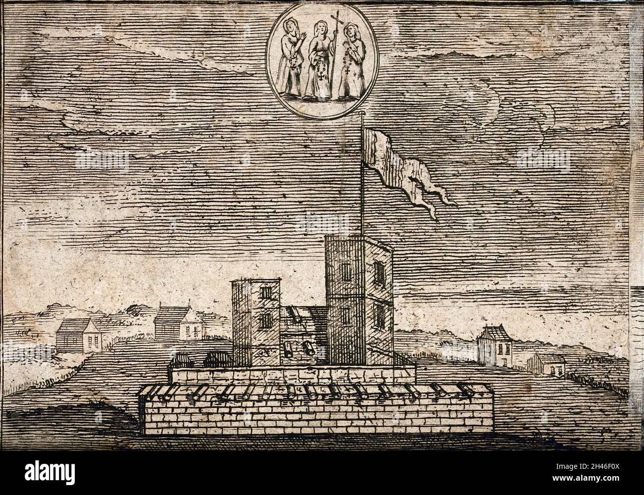 A building flying a pennent from a tower, surrounded by small houses ...