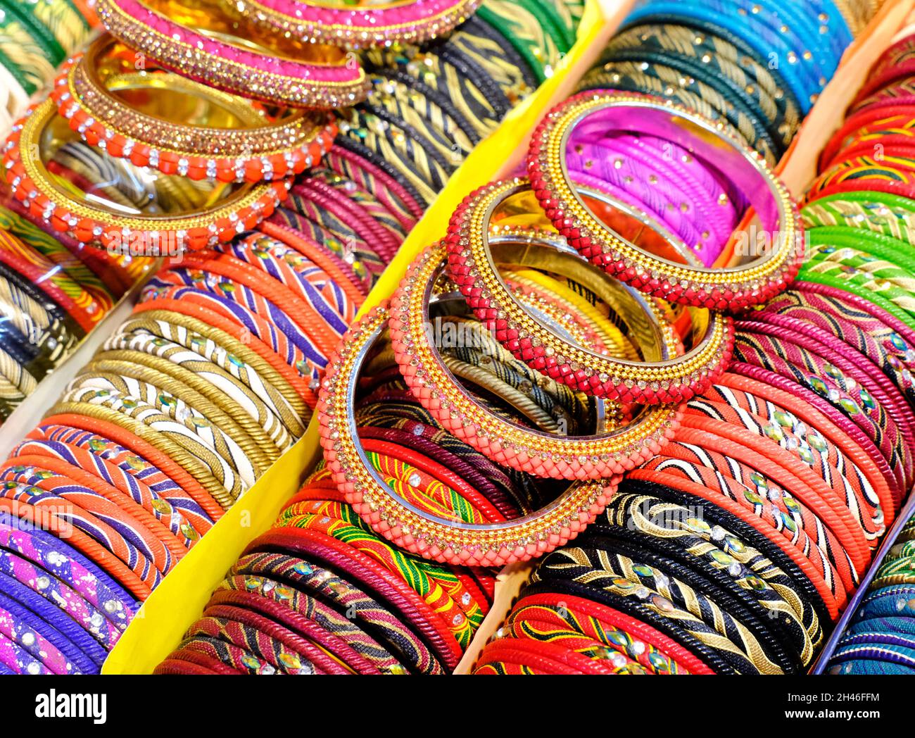 Indian colorful bangles displayed in local shop in a market of Pune ...