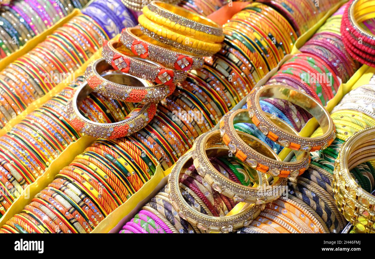 Indian colorful bangles displayed in local shop in a market of Pune ...