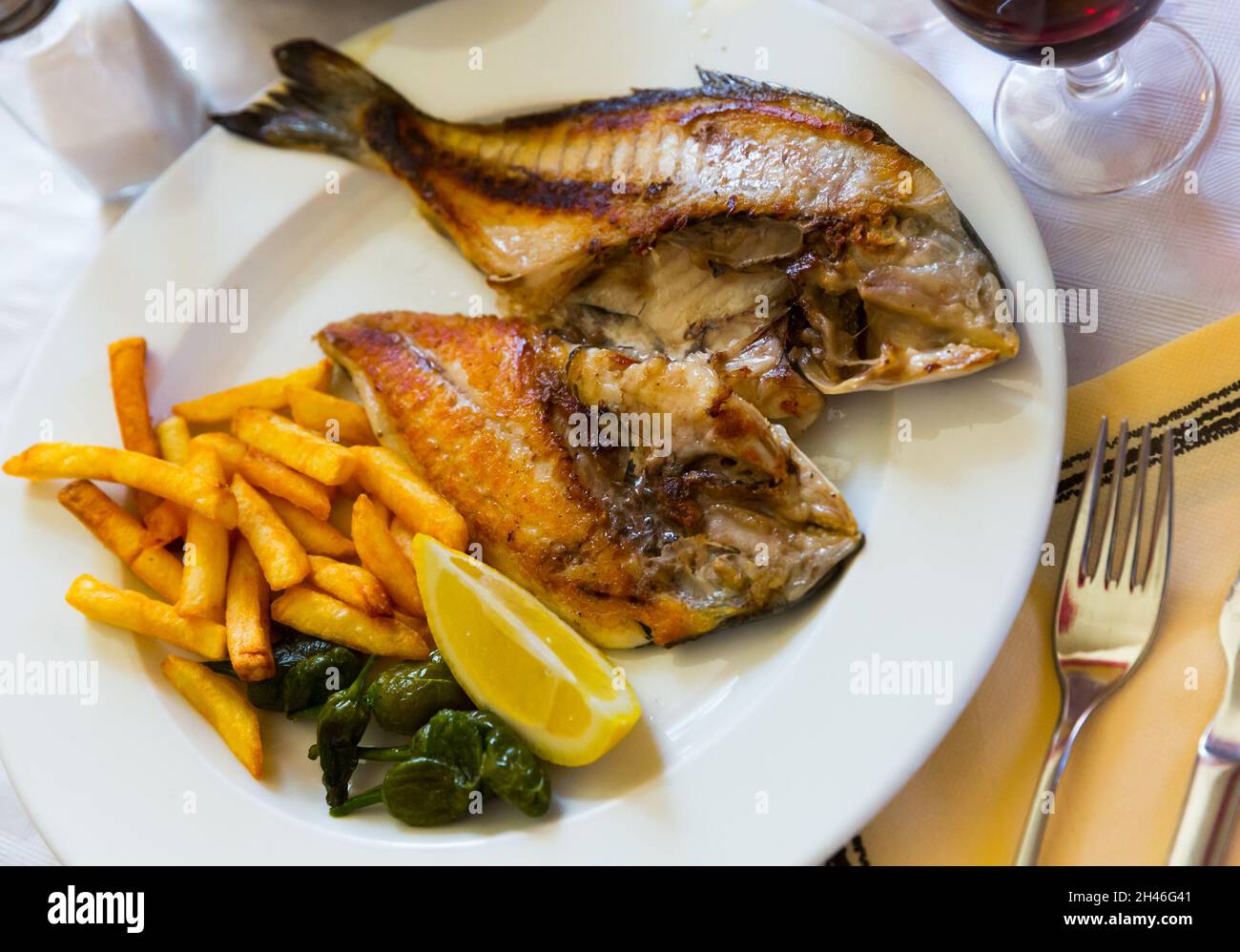 Fried cut dorada fish Stock Photo - Alamy