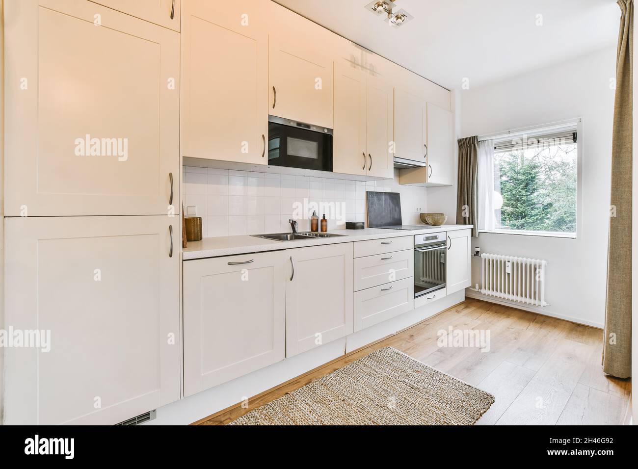Design of stylish kitchen set in white color Stock Photo - Alamy