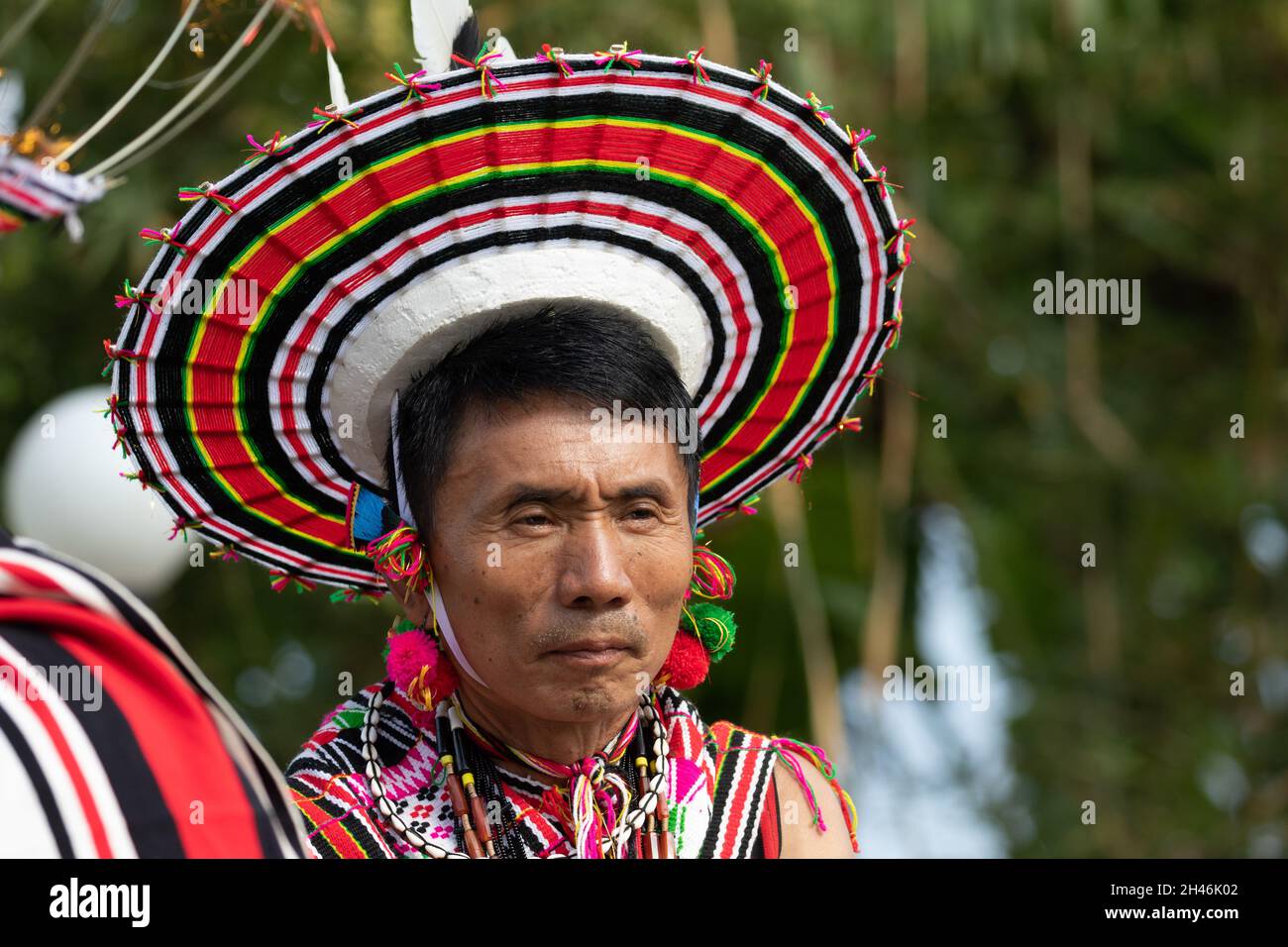 Portrait of a Naga tribes man dressed in traditional attire and ...