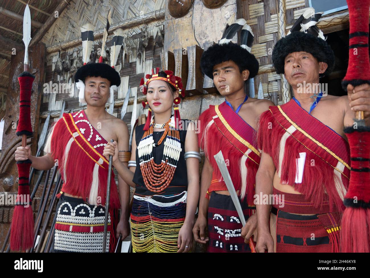 Naga tribesmen and a Naga women dressed in traditional attire with ...