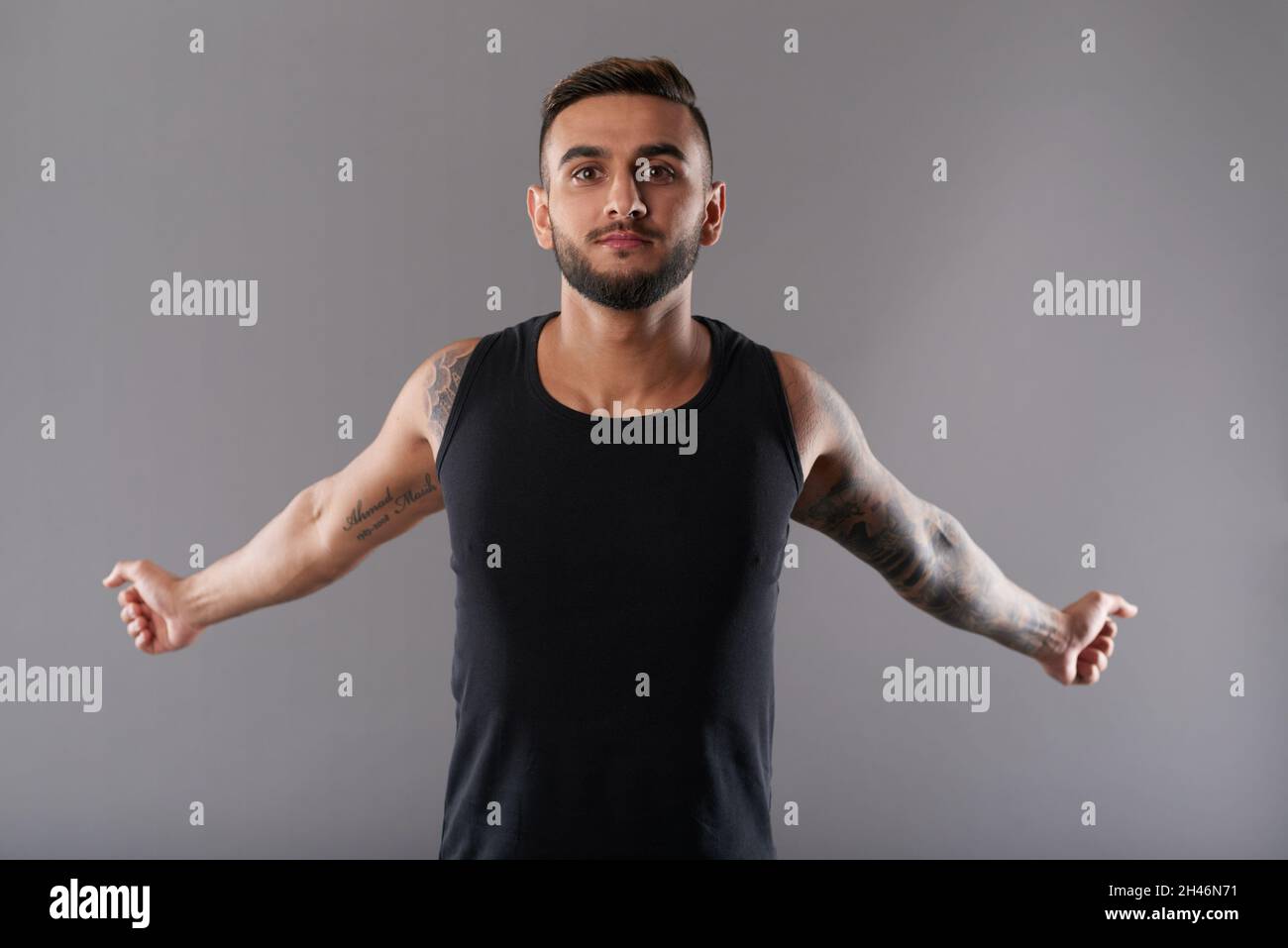 Handsome fit young man stretching chest muscles and opening chest Stock ...