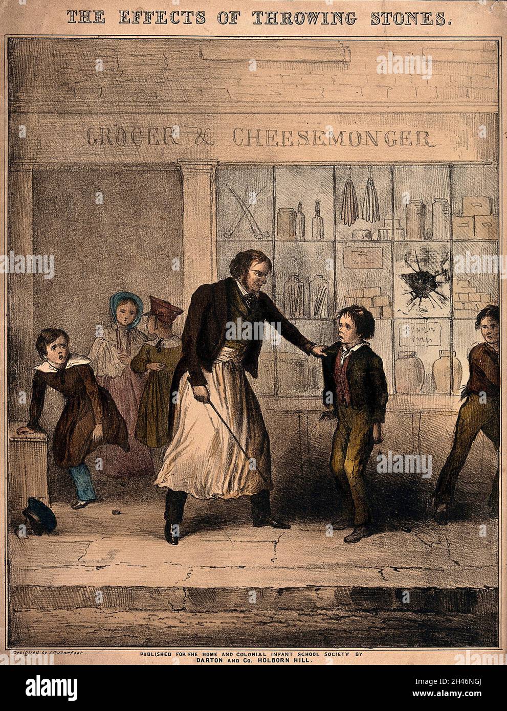 A boy is caught by a shopkeeper and threatened with a stick as ...