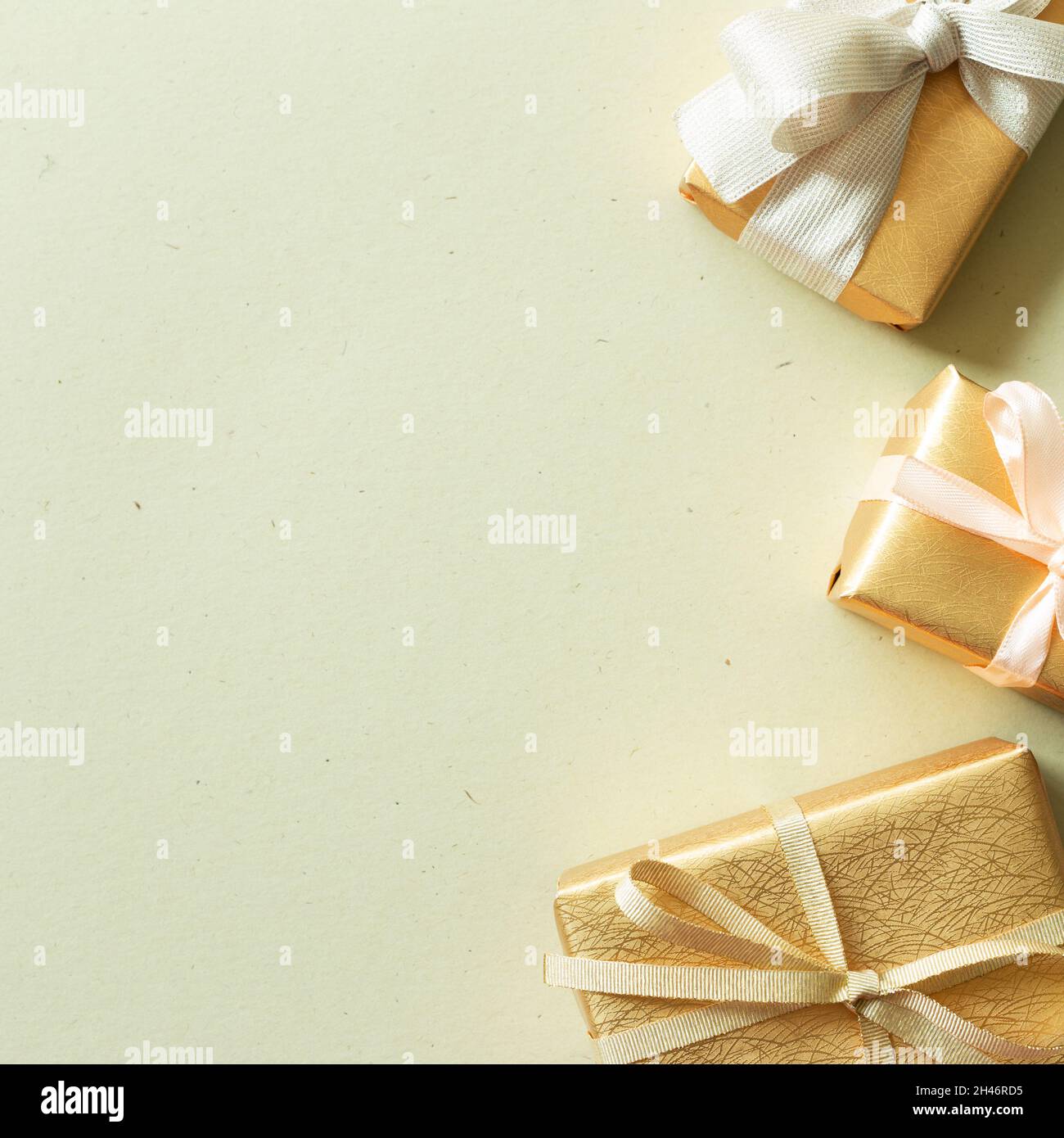 Gold gift boxes on khaki green background. top view, copy space Stock ...