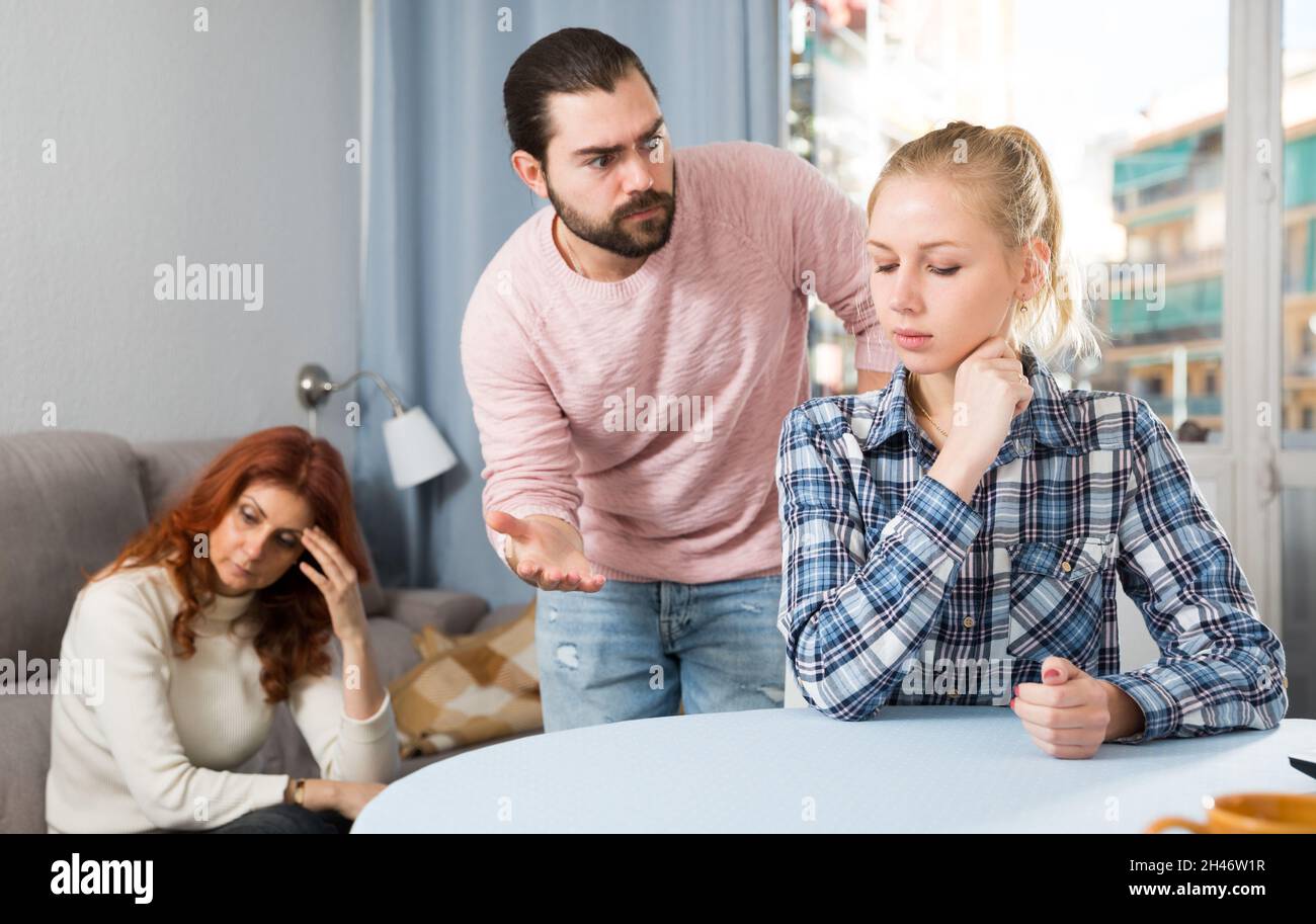 Young married couple and senior mother having bad discussion Stock ...
