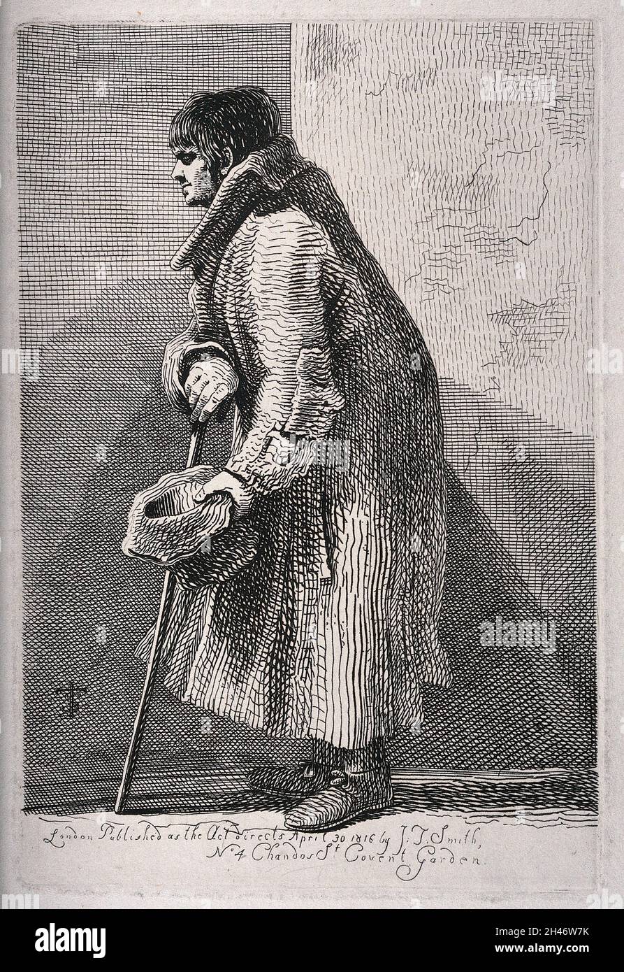 A blind beggar hunched over his walking stick, holding out his hat for ...