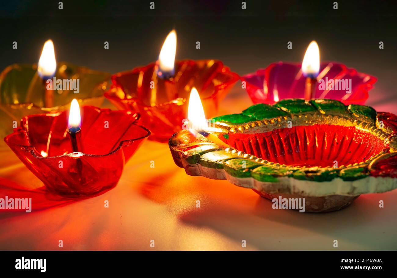 Traditional Diwali clay Diya lamps festival background content with ...