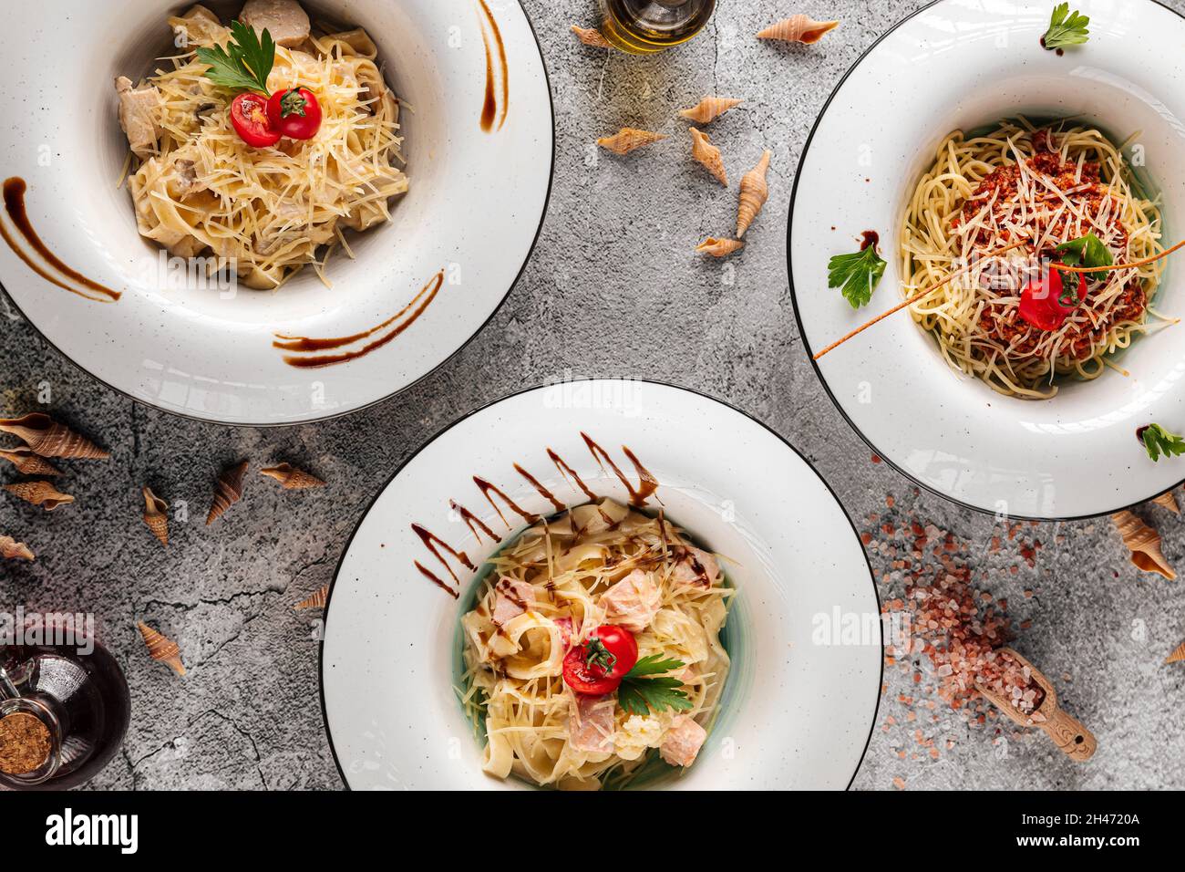 Top view on various italian spaghetti portions Stock Photo - Alamy