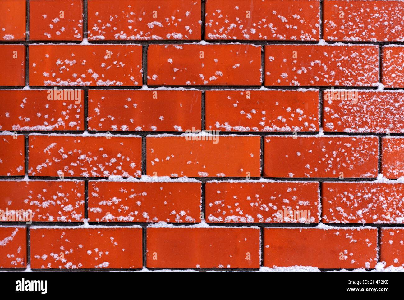 Red brick wall with snow on it after snowfall. Full frame Stock Photo ...