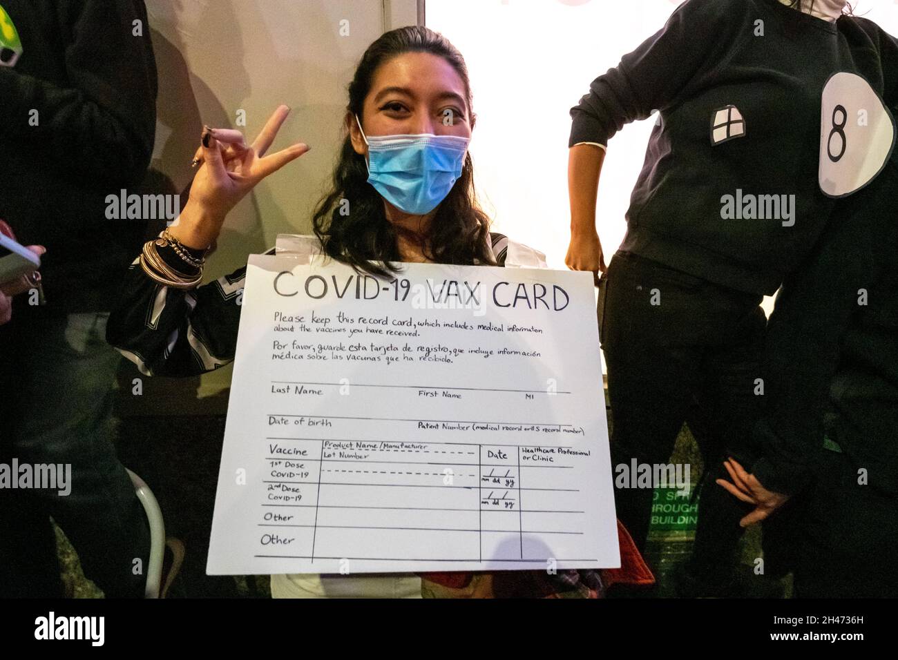 New York, USA. 31st Oct, 2021. A woman wears a costume representing a ...