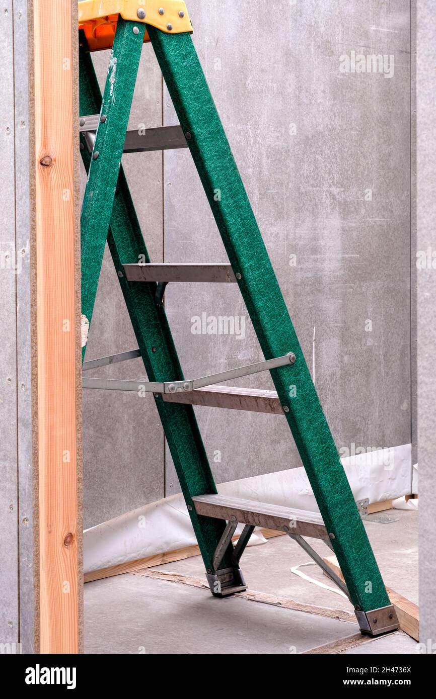 A step ladder standing inside of a house that is under construction ...