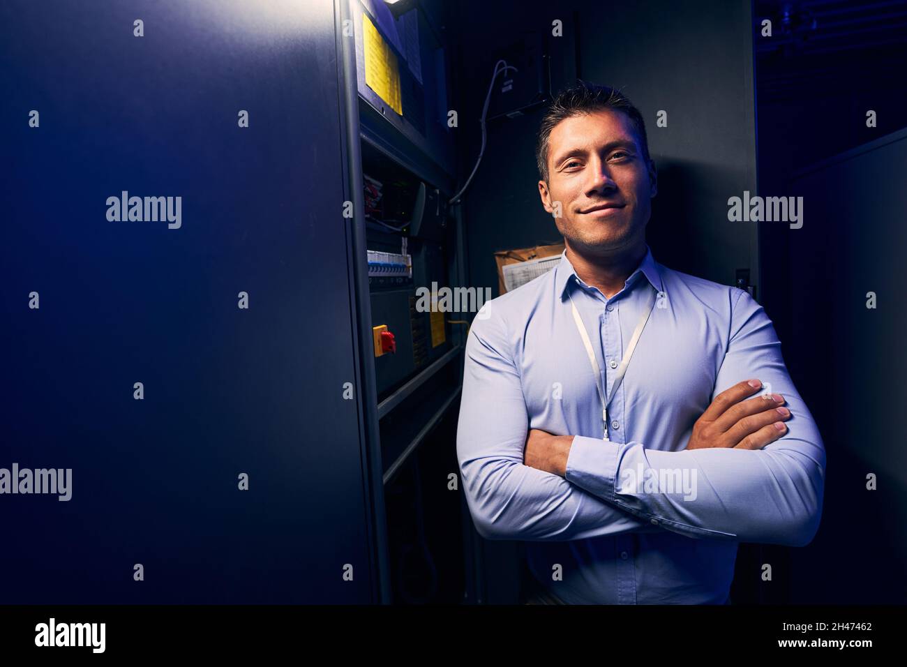 Contented data center employee smiling at camera Stock Photo - Alamy
