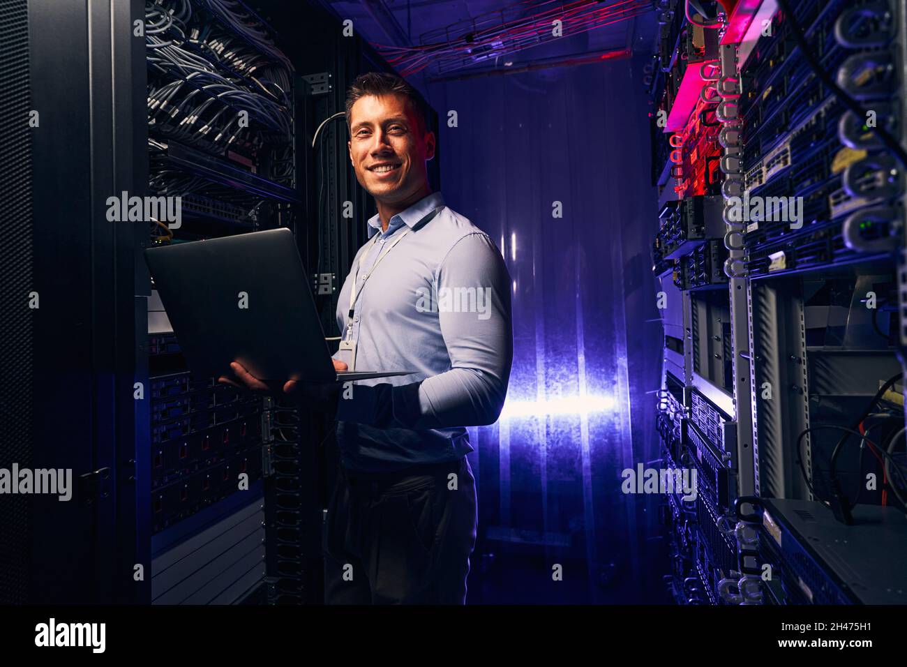 Cheerful data center system administrator hi-res stock photography and images - Alamy