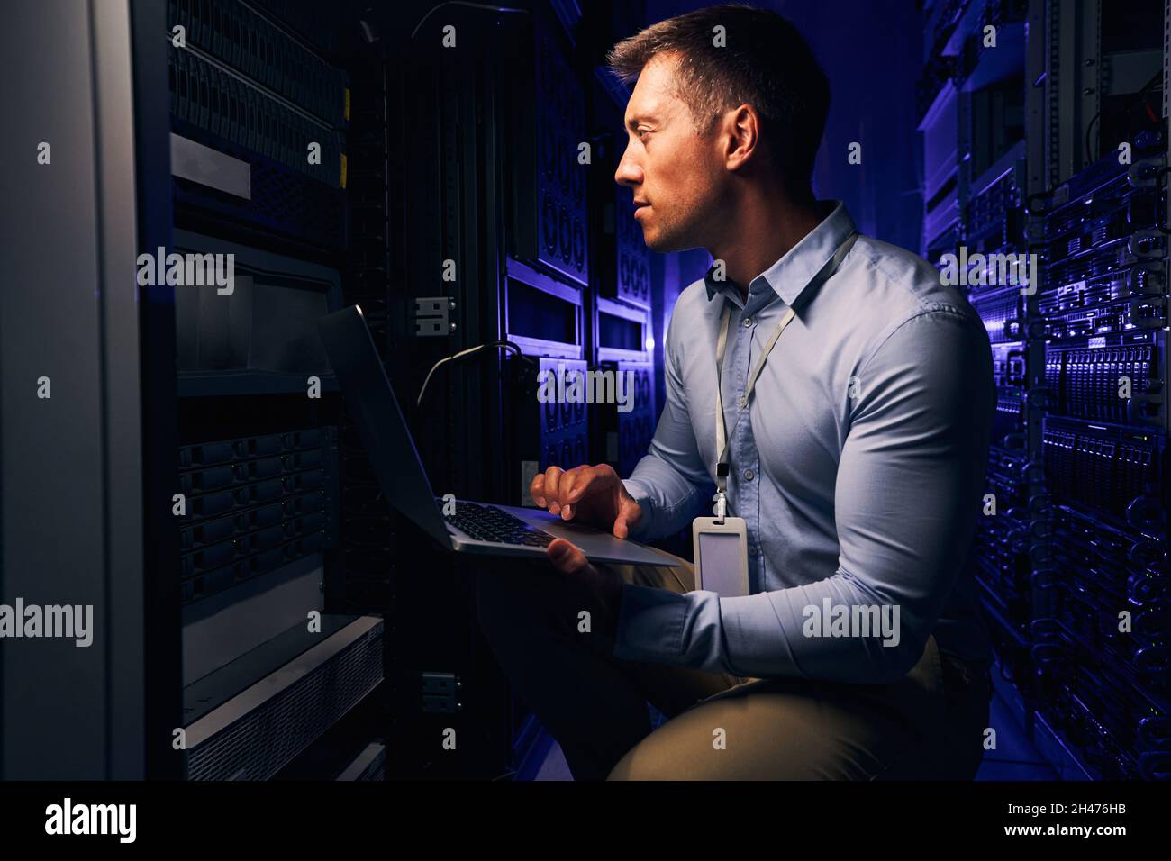 IT professional checking data center hardware equipment Stock Photo - Alamy