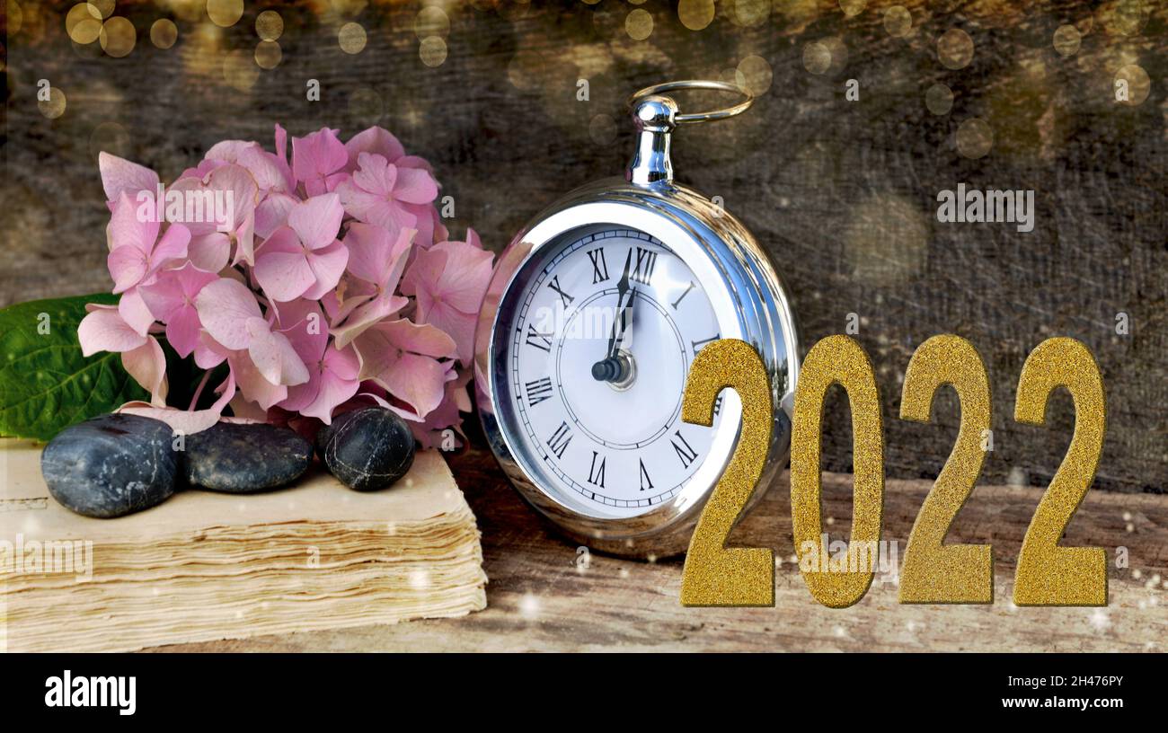 2022 golden year front of clock marking soon midnight in illuminated ...