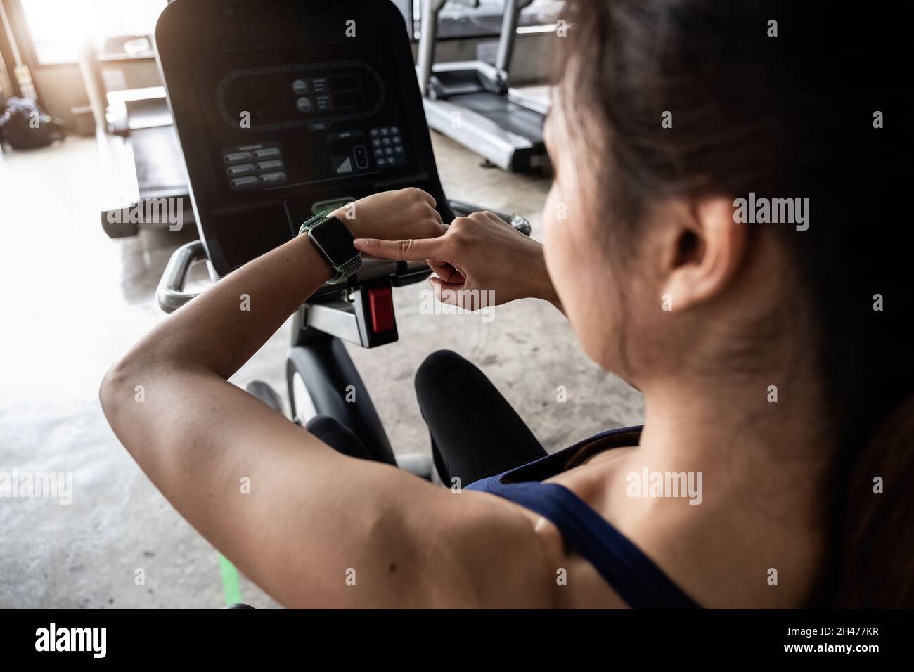 Young woman workout in gym healthy lifestyle, Woman is using smart ...