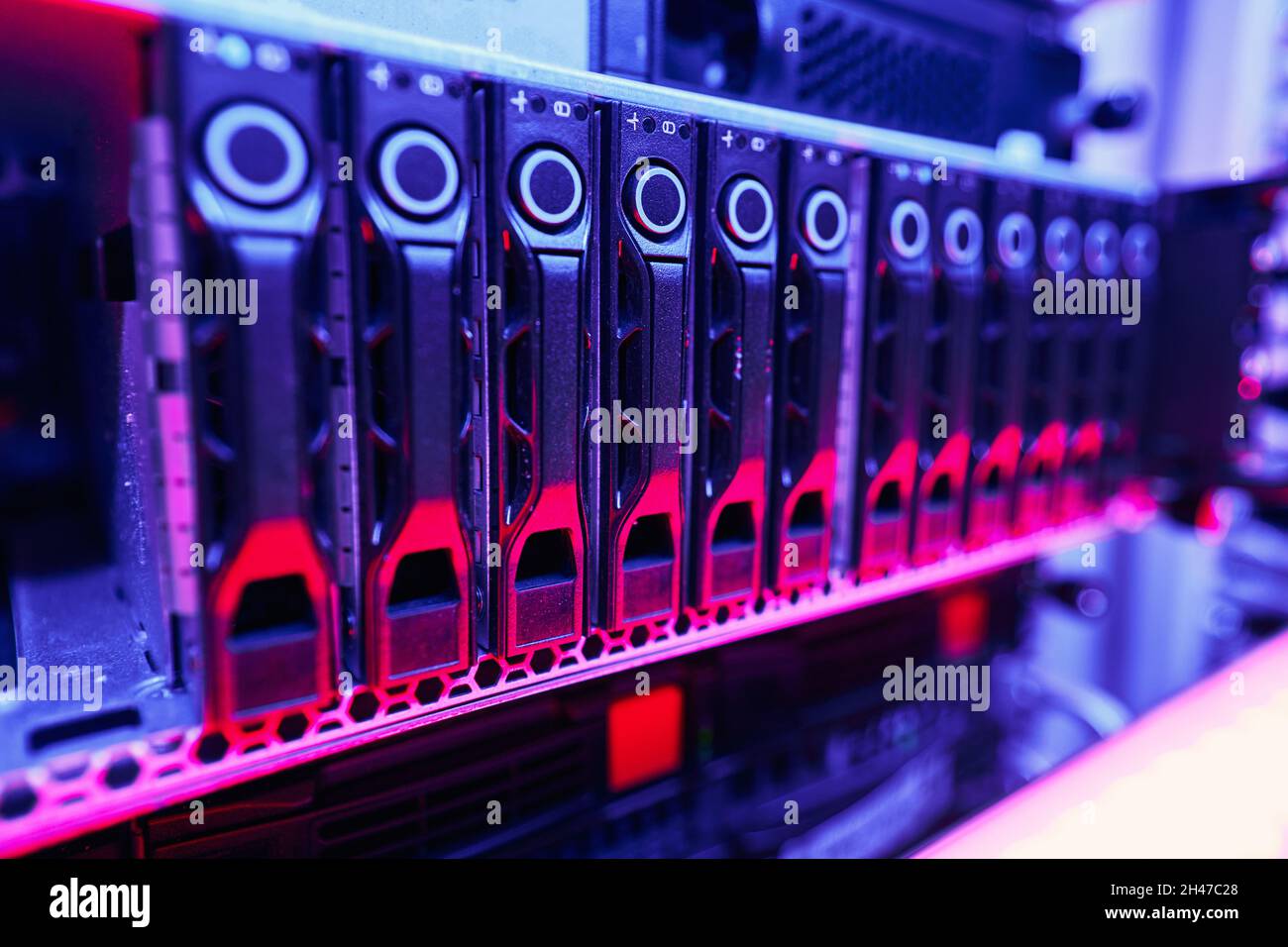 Up-to-date rack-mounted illuminated computer hardware in data center ...
