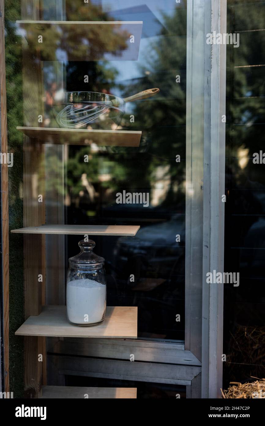 flour in a glass jar in a shop window Stock Photo - Alamy