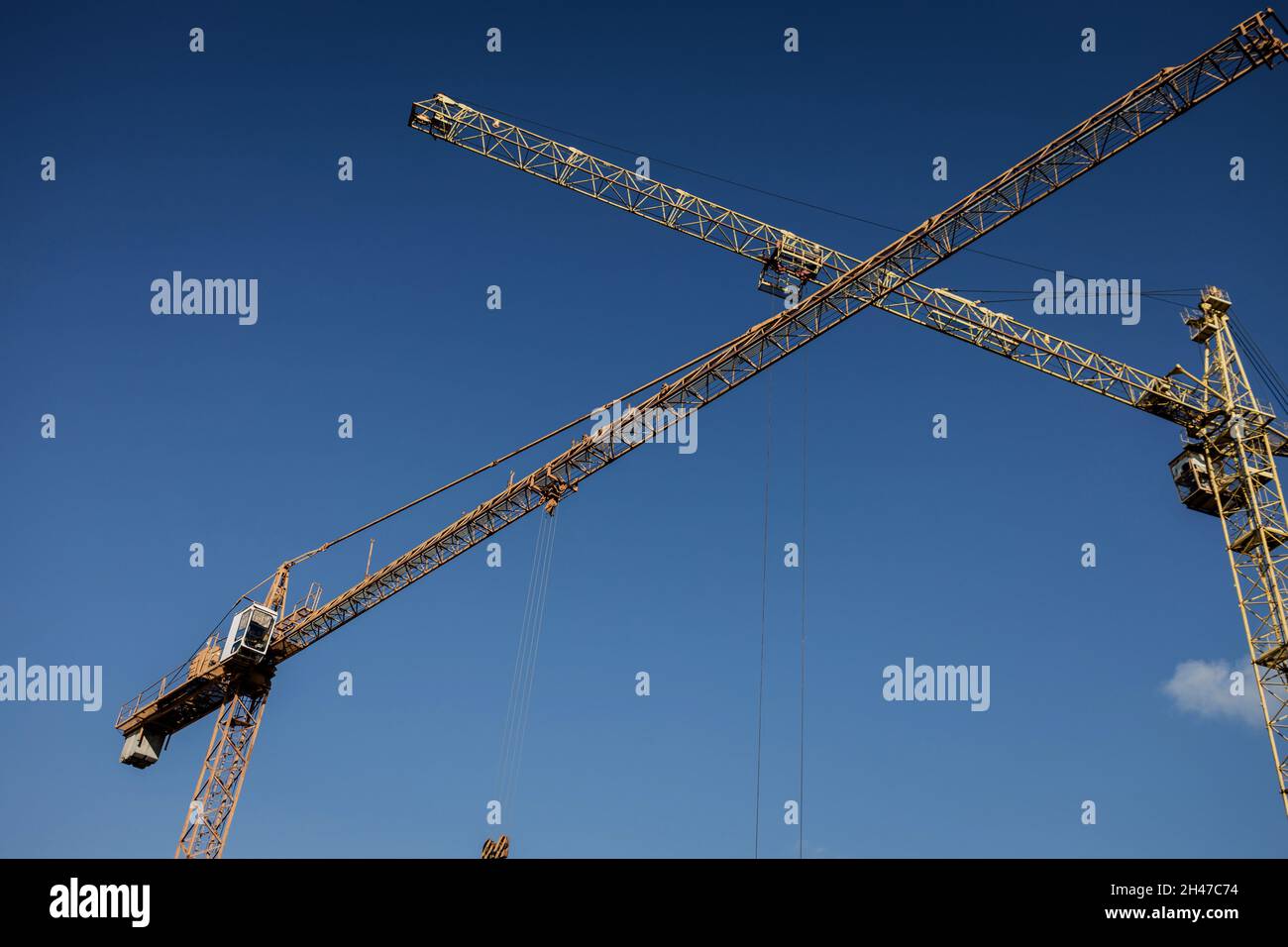 Two yellow cranes on hi-res stock photography and images - Alamy