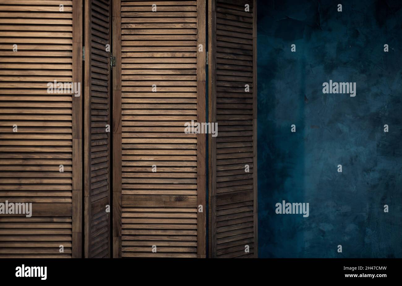 loft interior. wooden screen in the apartment. copy space Stock Photo ...