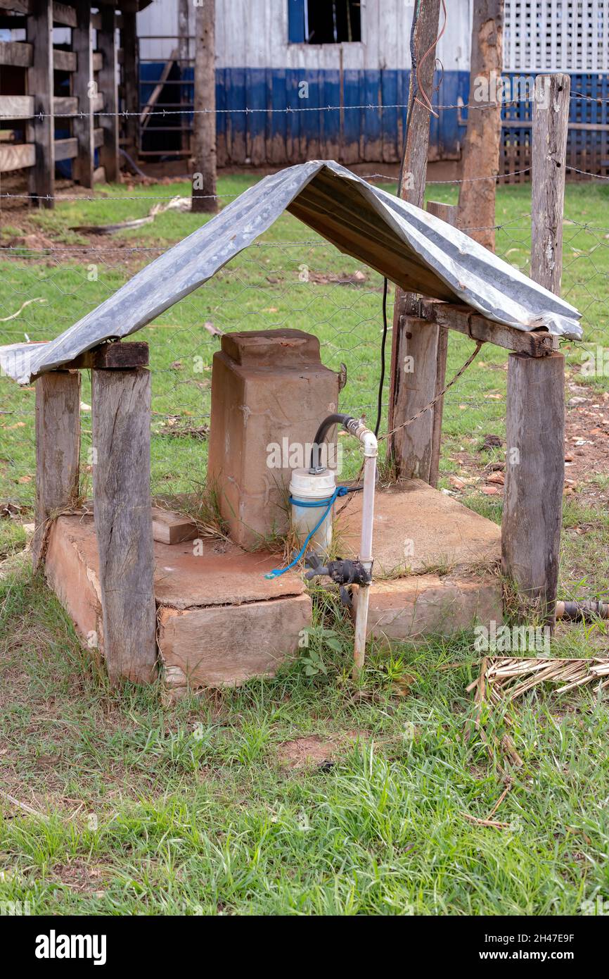 Improvised artesian well on a farm for pumping water Stock Photo - Alamy