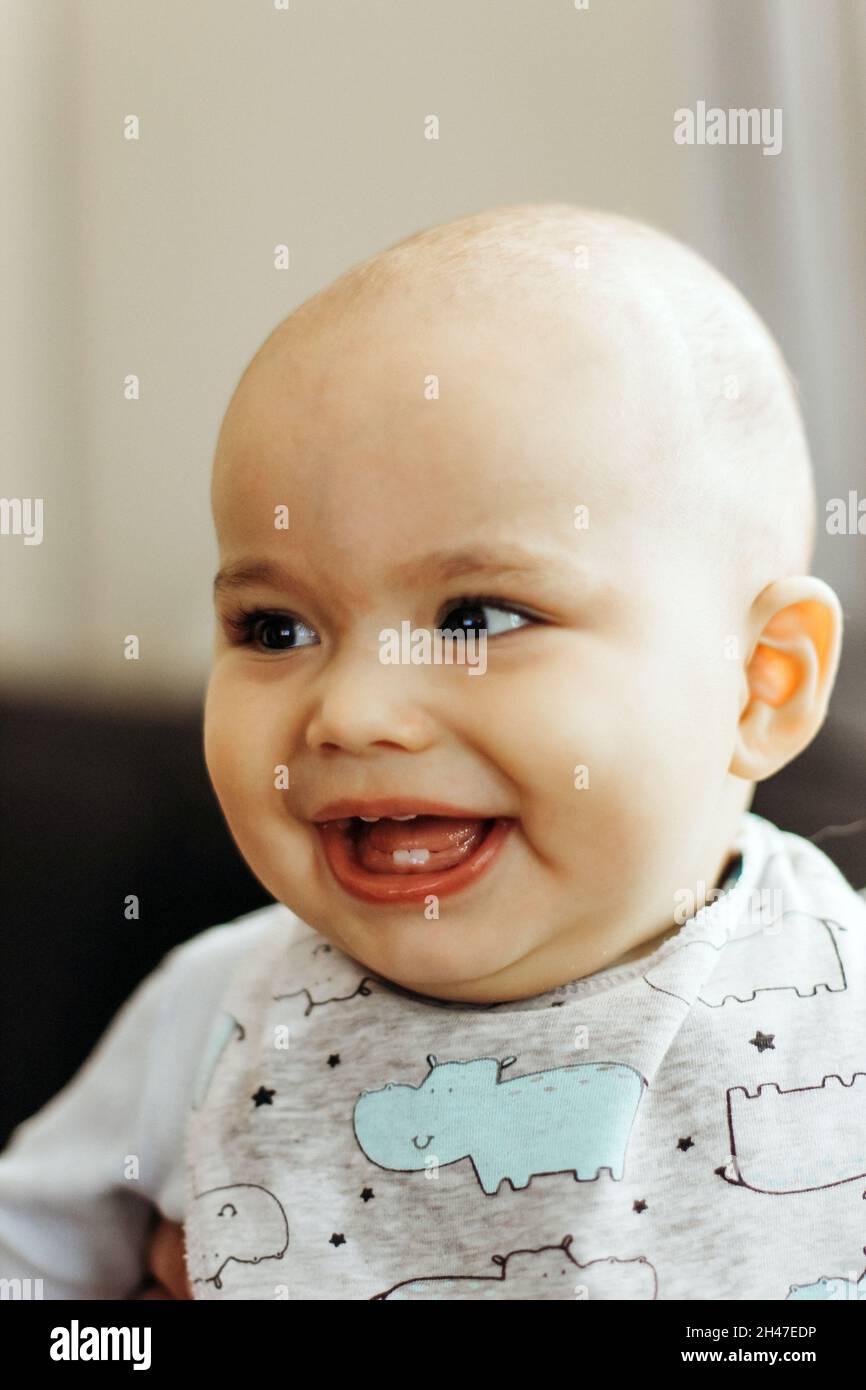 Sweet little baby boy with chubby cheeks and big eyes. Portrait of ...