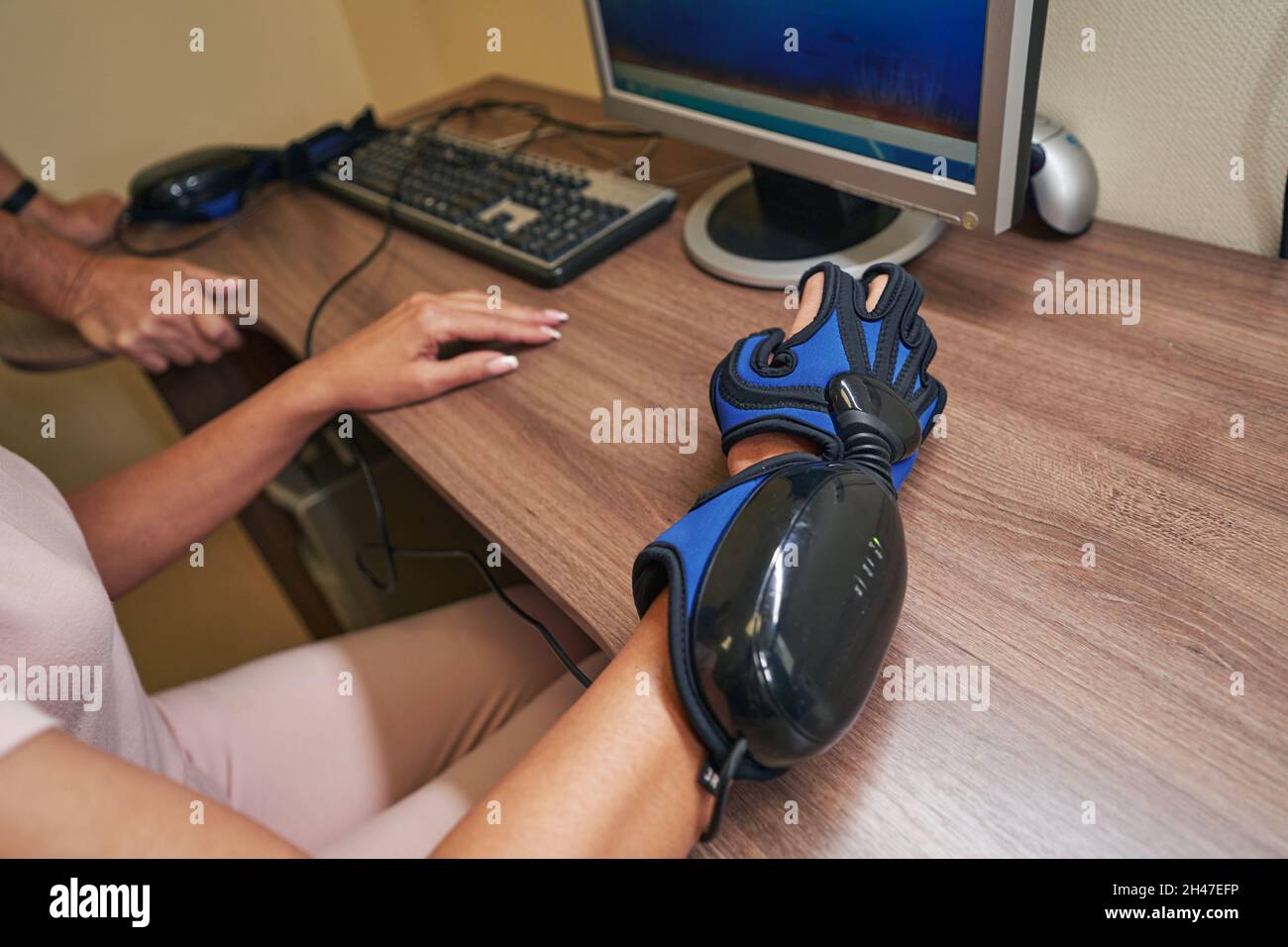 Stroke patient uses robotic rehabilitation in rehab center Stock Photo ...