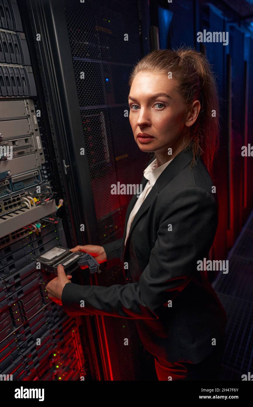 Cute woman administrator checking equipment in data center Stock Photo - Alamy