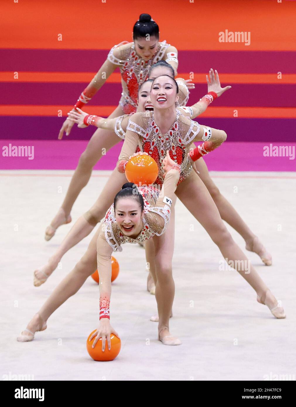 Japanese gymnasts perform in the group 5 balls final en route to taking ...