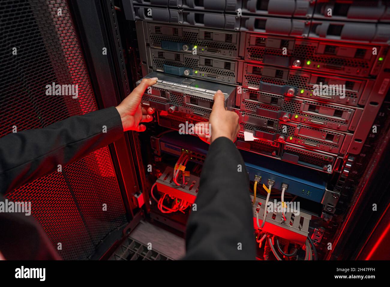 Replacement of hard drive in storage system of data center Stock Photo ...