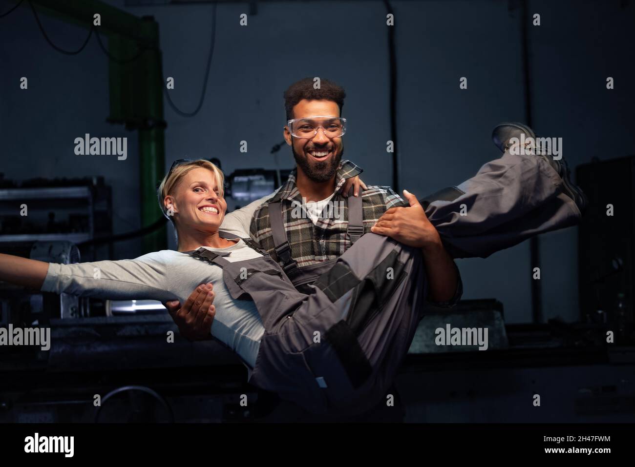 Man lifting woman up hi-res stock photography and images - Alamy