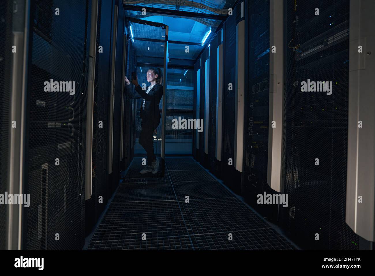 IT engineer checking servers in data center Stock Photo - Alamy