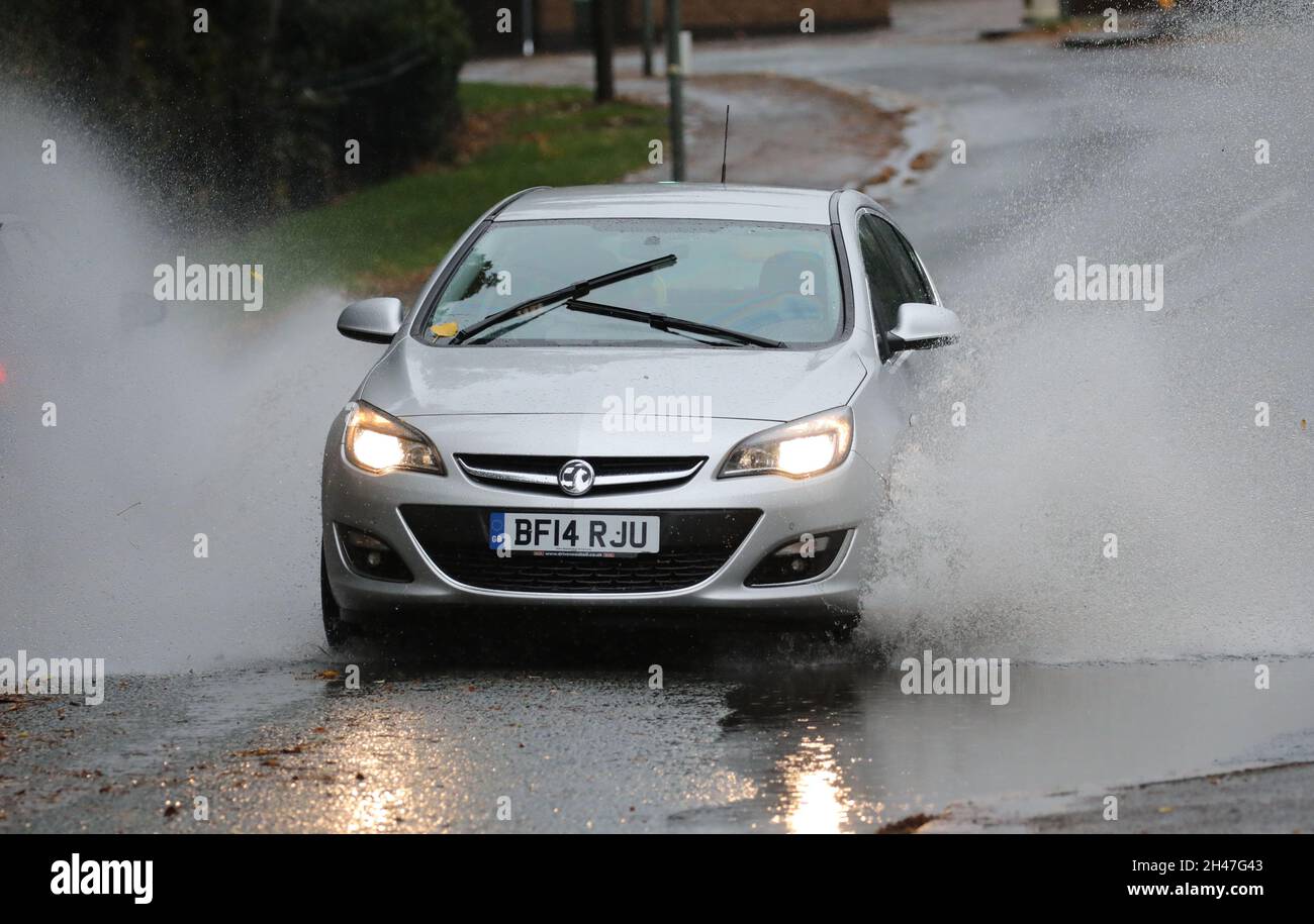 Car driving through puddle hi-res stock photography and images - Alamy