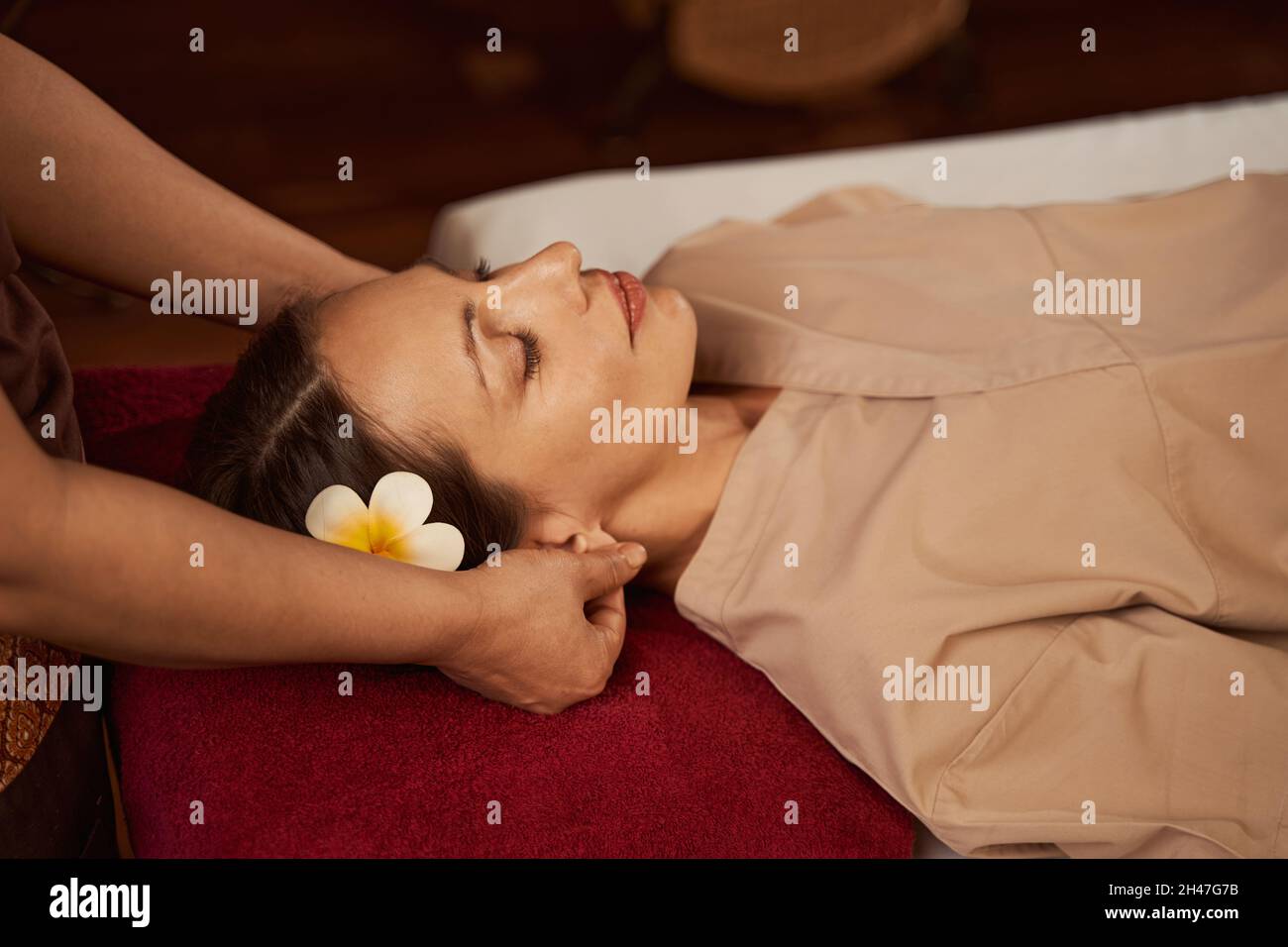 Woman earlobe massage hi-res stock photography and images - Alamy