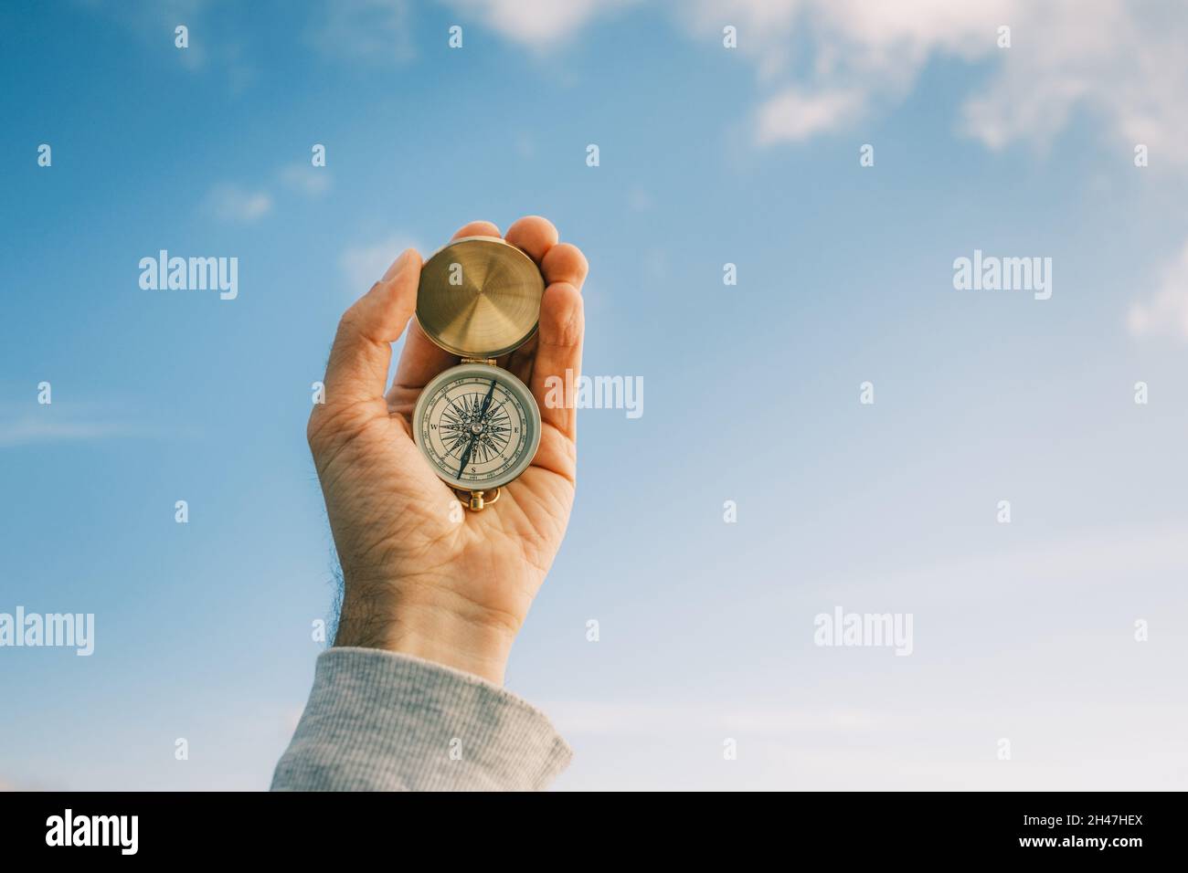 Vintage compass in hand hi-res stock photography and images - Alamy