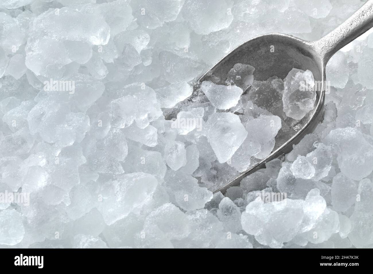 Crushed ice with a scoop close up full frame as background Stock Photo ...